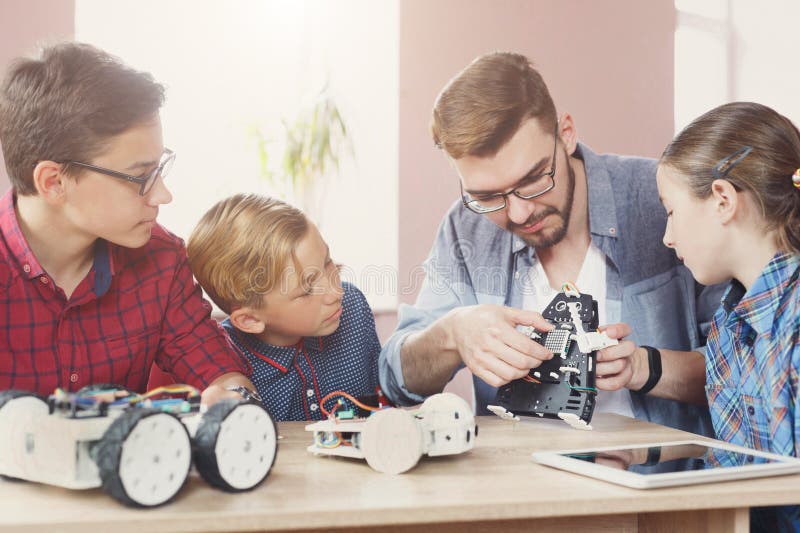 Stem Education. Kids Creating Robots with Teacher Stock Image - Image ...