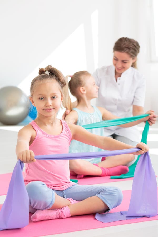 Children doing exercise stock photo. Image of band, health - 75502114