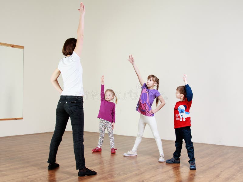 Children are Doing Exercises with a Trainer Stock Photo - Image of ...