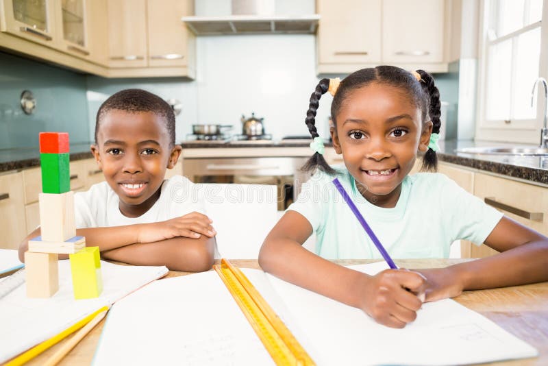 Children Doing Homework in the Kitchen Stock Image - Image of black ...