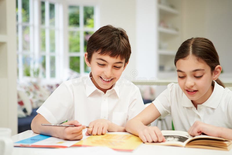 Children Doing Homework in Kitchen Stock Image - Image of writing ...