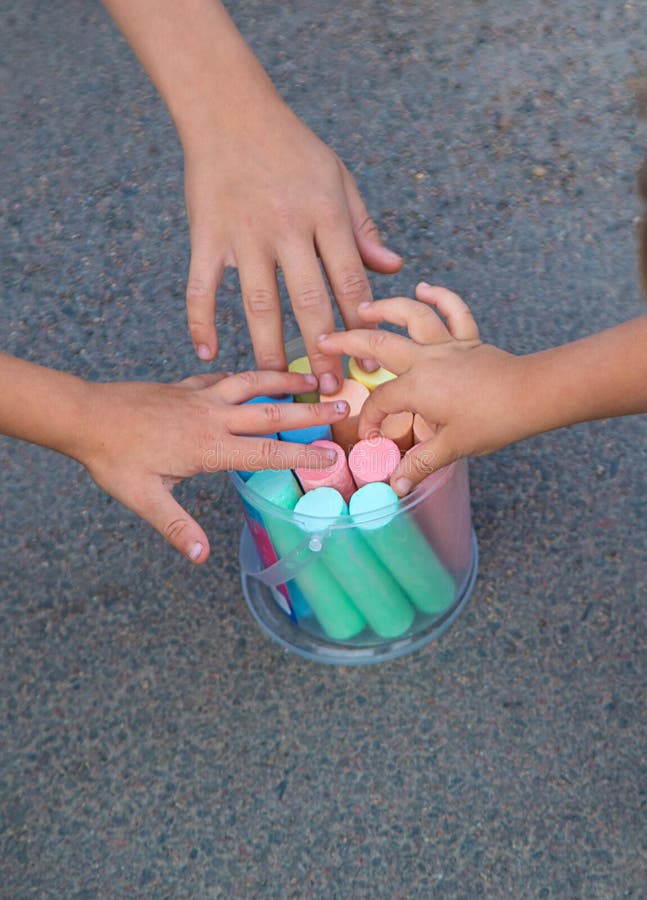 Children Draw with Chalk on the Asphalt. Selective Focus Stock Image ...