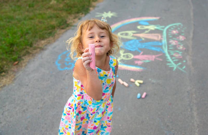 Children Draw with Chalk on the Asphalt. Selective Focus Stock Image ...
