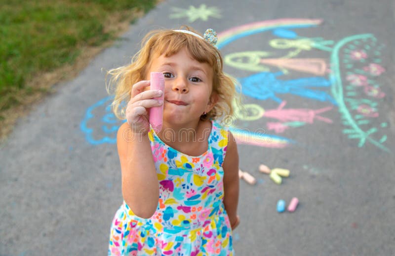 Children Draw with Chalk on the Asphalt. Selective Focus Stock Photo ... Children Draw with Chalk on the Asphalt. Selective Focus Stock Photo ...