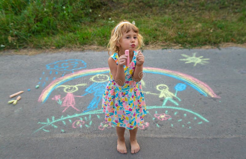 Children Draw with Chalk on the Asphalt. Selective Focus Stock Image ...