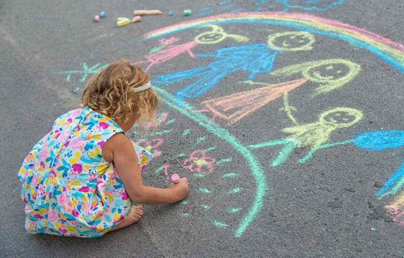 Children Draw with Chalk on the Asphalt. Selective Focus Stock Photo ...