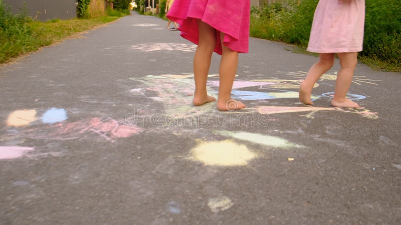Children Draw with Chalk on the Pavement. Selective Focus Stock Footage ...