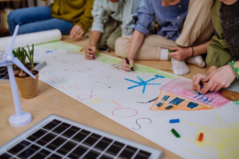 Children Drawing a Project To Environmental Lesson. Stock Image - Image ...