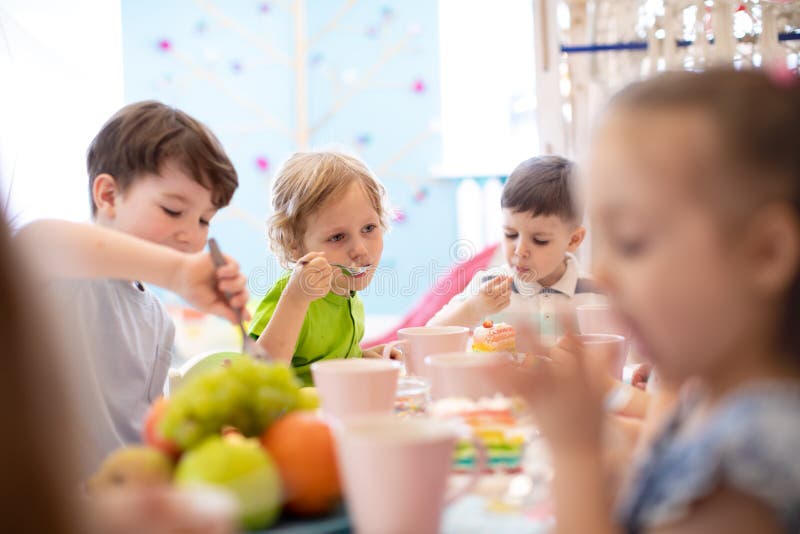 Children Eat Cake at Birthday Party Stock Photo - Image of childhood ...