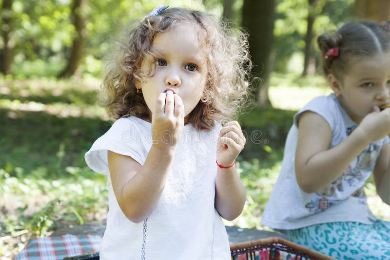 Children eat outdoors stock photo. Image of apple, outside - 59526490