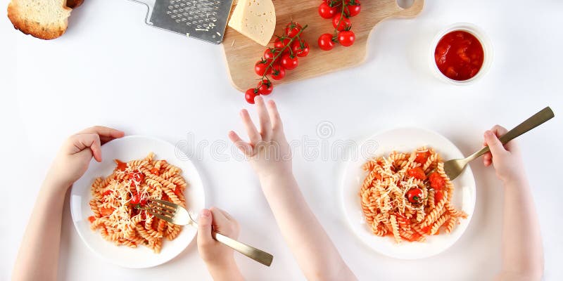 Children Eat Pasta, Top View Stock Photo - Image of dish, view: 242388434