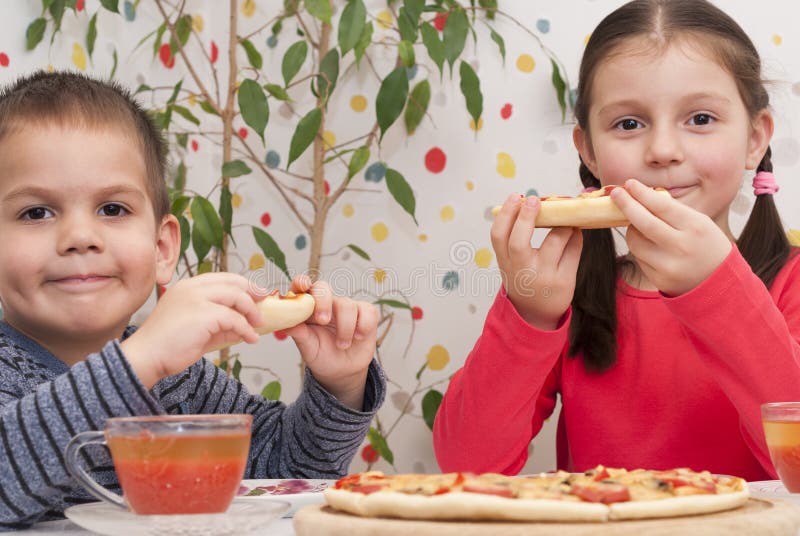 Children eat pizza stock photo. Image of girl, home - 108302058