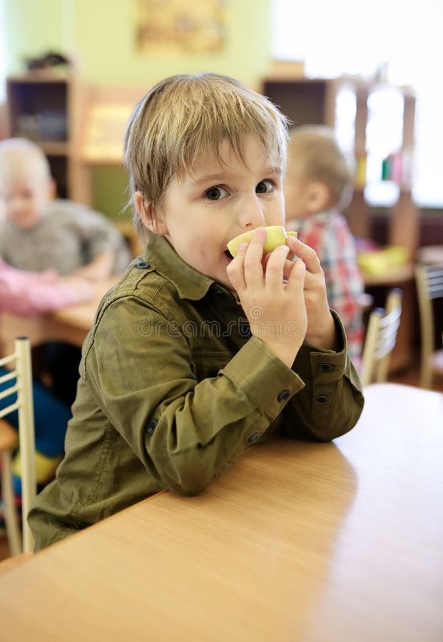 Children Eating Apple in Kindergarten Stock Photo - Image of cute ...