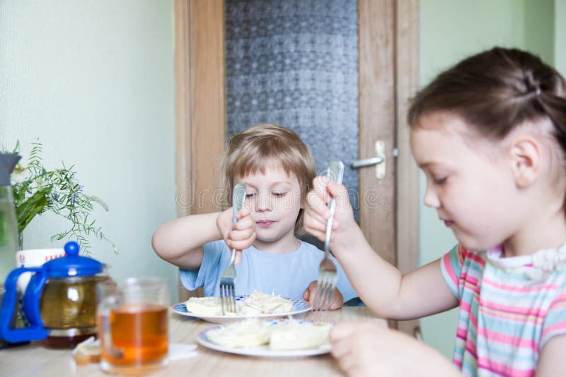 Children Eating Breakfast in Kitchen. Stock Image - Image of breakfast ...