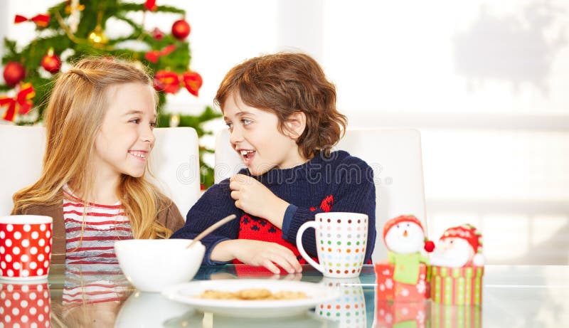 Children eating cookies at stock photo. Image of giving - 44420850