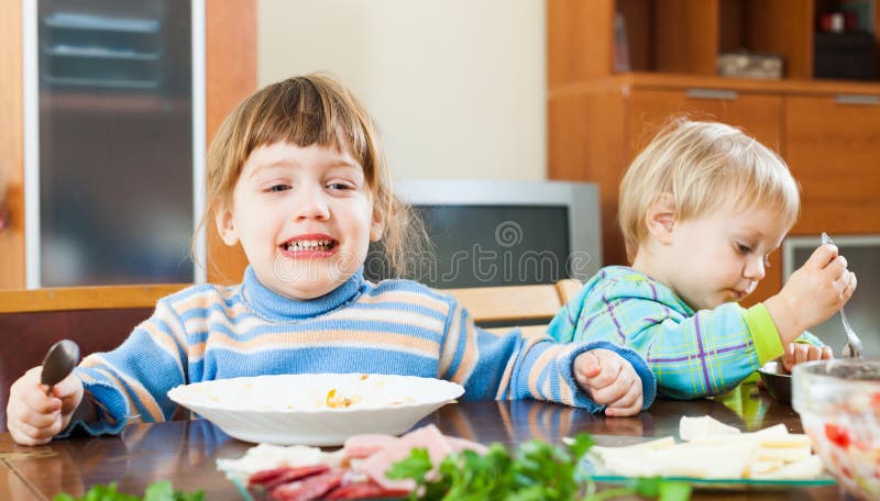Happy Baby Girls Eating Food Plates Stock Photos - Free & Royalty-Free ...
