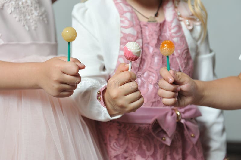 Children Eating Lollipops on a Stick Close Up Stock Photo - Image of ...