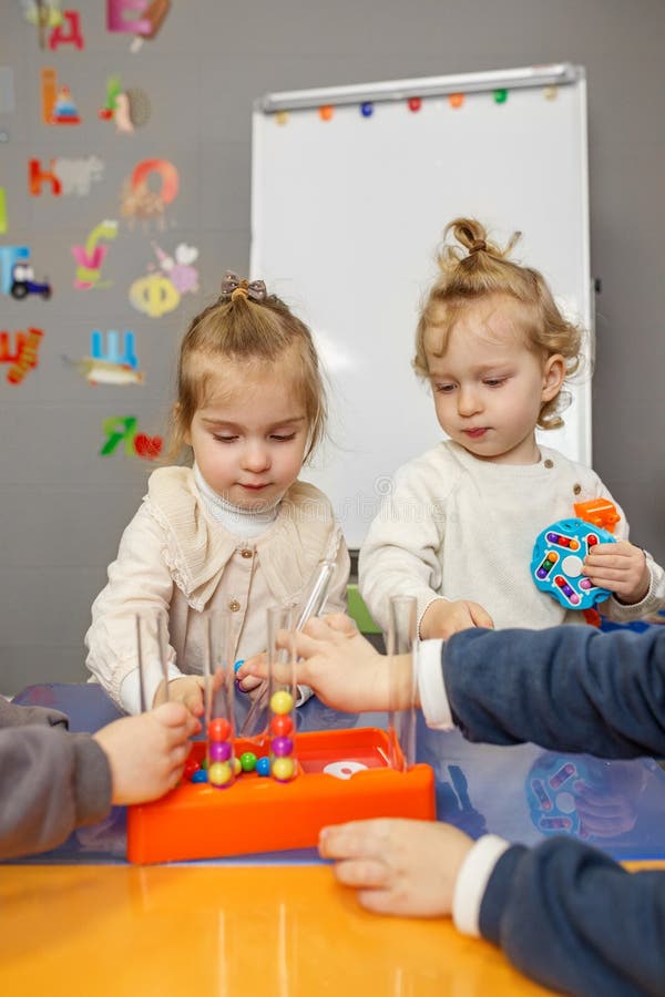 Children Engaged in Educational Play with Beads Stock Image - Image of ...