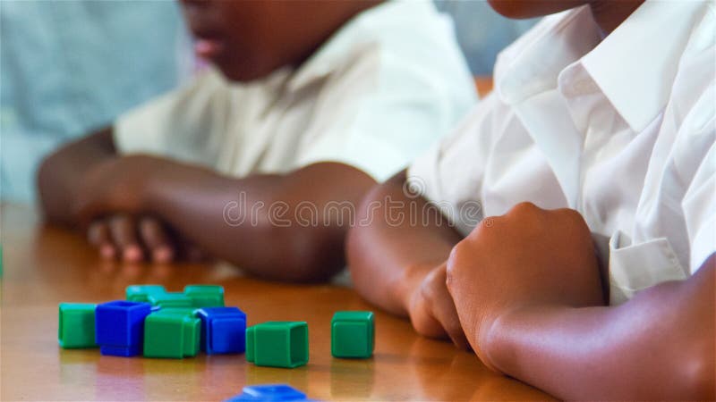 Children Engaged in Learning Activities at a Classroom Table during ...