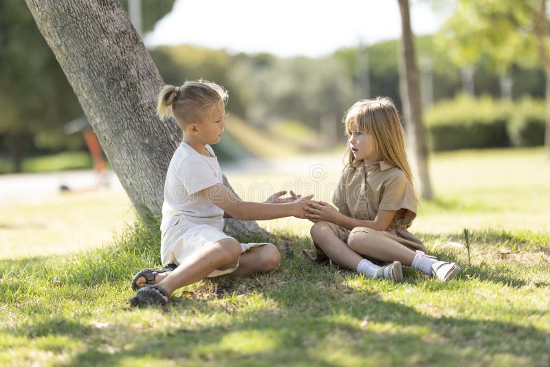 Children Engaging Playful Conversation Outdoors Stock Photos - Free ...