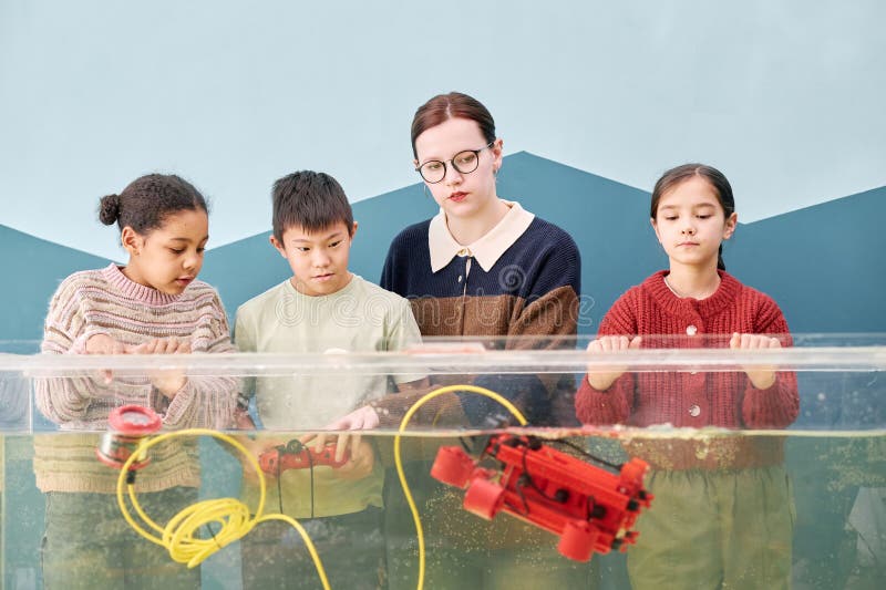Children Engaging in STEM Learning with Robotics Exhibit Stock Image - Image of understand ...