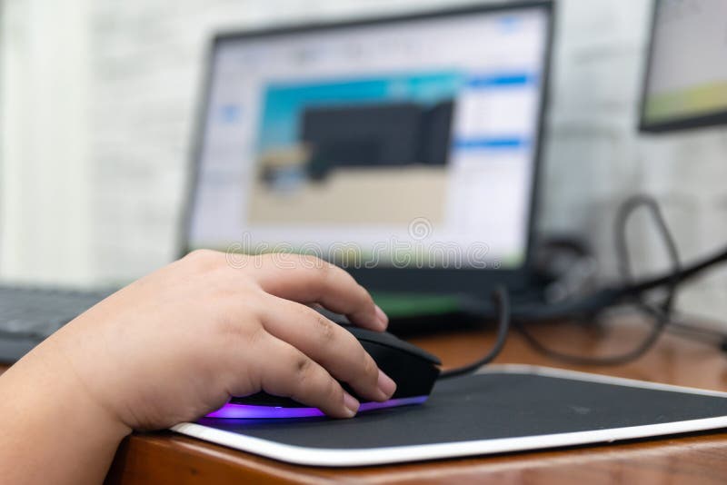 Children Enjoying Computer Games while Holding Computer Mouse Stock ...