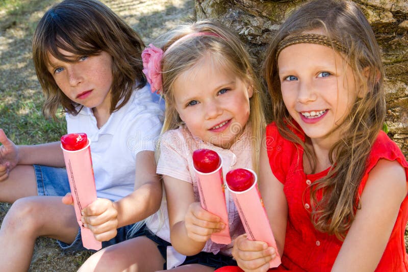 Children Enjoying Ice Pops. Stock Image - Image of caucasian ...