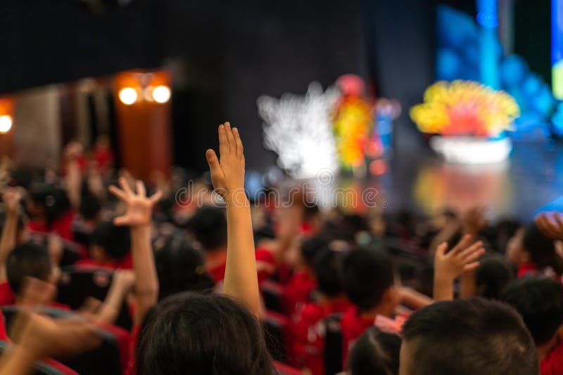 Children Excitingly Raise Hands Watching the Performance in the Theater ...