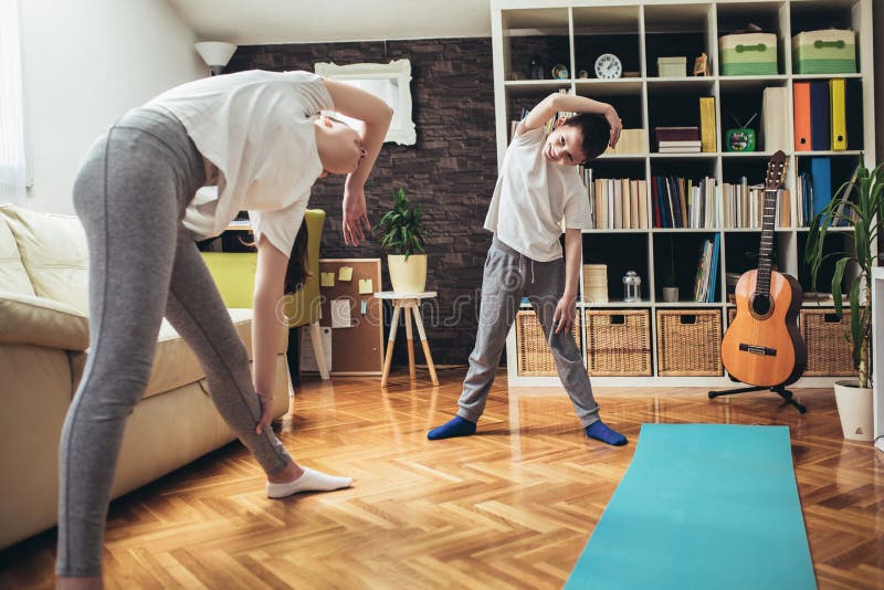 Children Exercising at Home. Stock Photo - Image of pandemic, smile ...