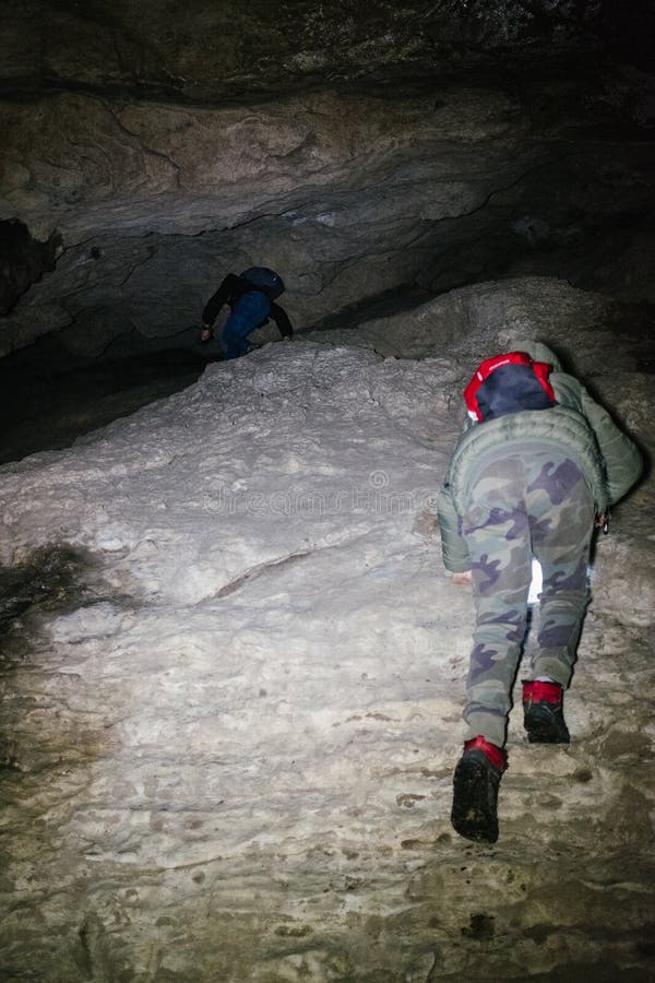 Children Explore an Underground Cave with Pile, Adventurously Stock ...
