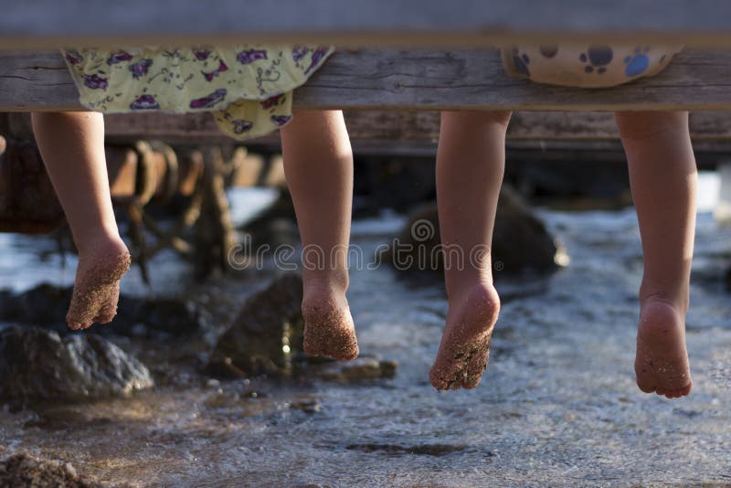 Children feet above water stock photo. Image of splashing - 57151548