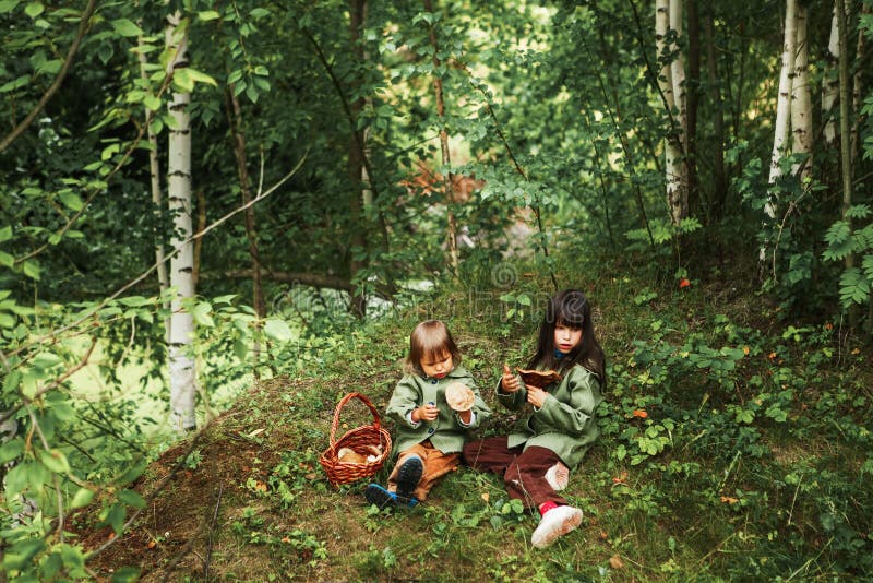 Children in forest. stock photo. Image of resting, grass - 74858806