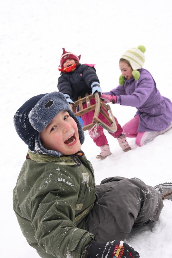 Children fun on the snow stock image. Image of friends - 22740125