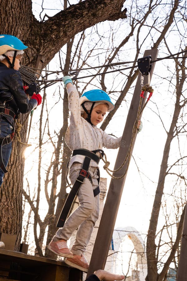 Children Girls Climb in Rope Park in the Spring Stock Photo - Image of ...