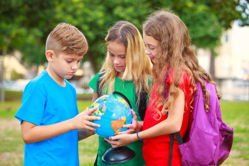 Children with a Globe are Learning Geography Stock Photo - Image of ...