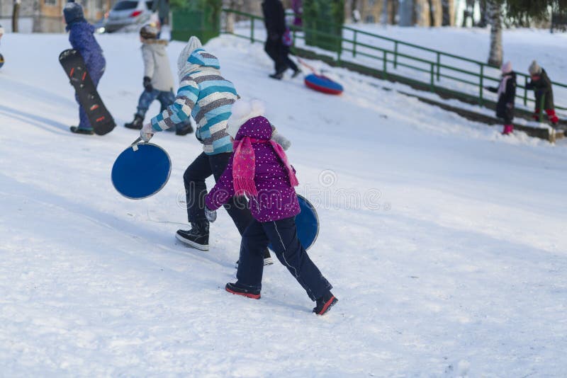 Children Go Sledding in Winter .Winter Entertainment and Recreation ...