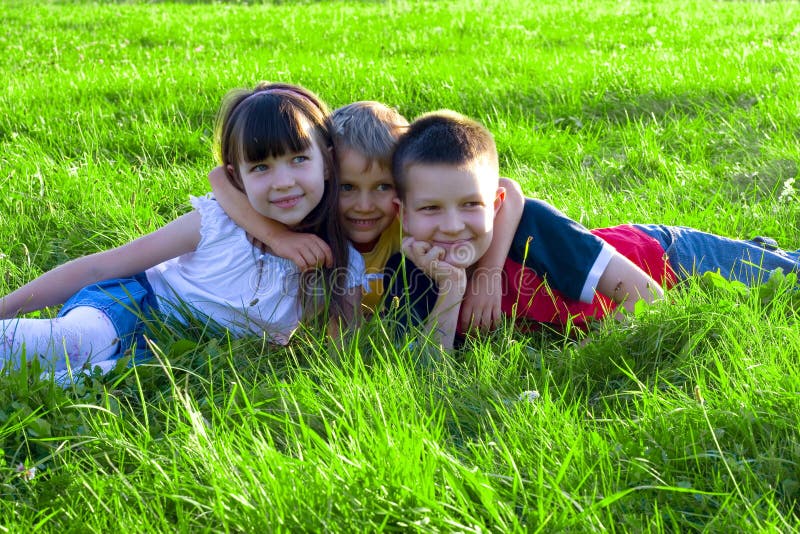 Children on green grass stock image. Image of brothers - 34138581