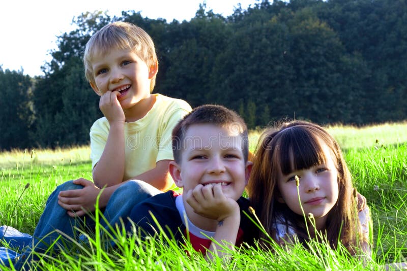 Children in grass stock photo. Image of long, eyes, families - 1305836