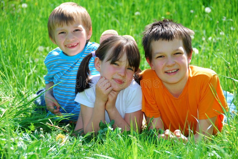 Children in the Grass stock photo. Image of park, leisure - 5253788