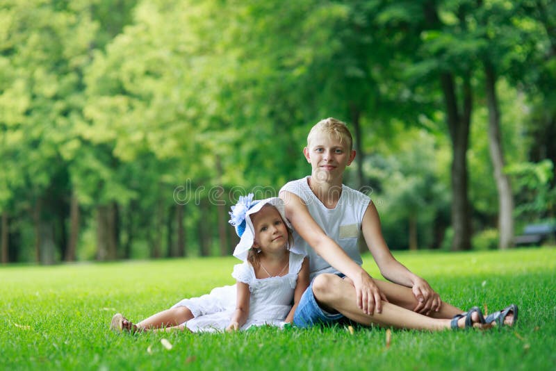 Children on the grass stock photo. Image of garden, happy - 123056716