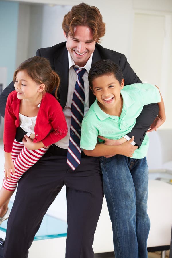 Children Greeting Father on Return from Work Stock Photo - Image of ...