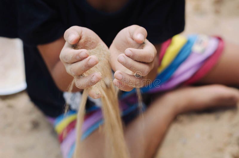 Children hand hold sand stock image. Image of finger - 91428915