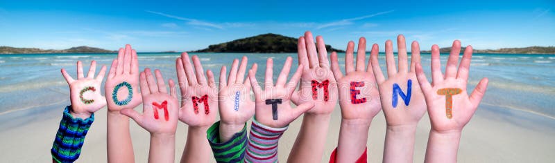 Children Hands Building Word Commitment, Ocean Background Stock Photo ...