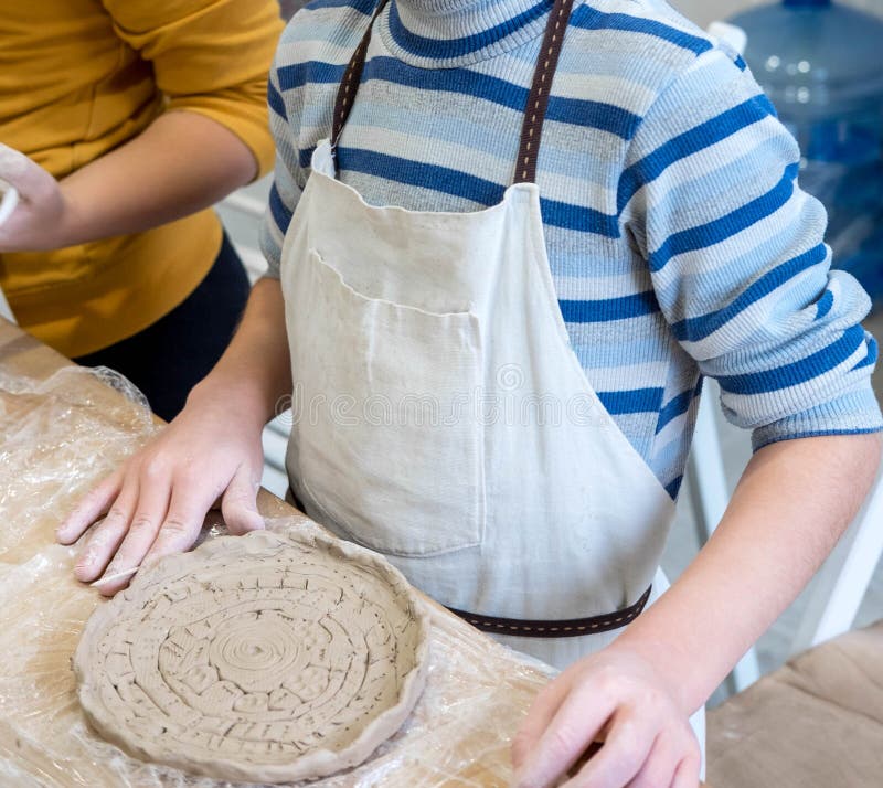 Children Hands that Hold Crafts Made from Clay. Children Creativity ...