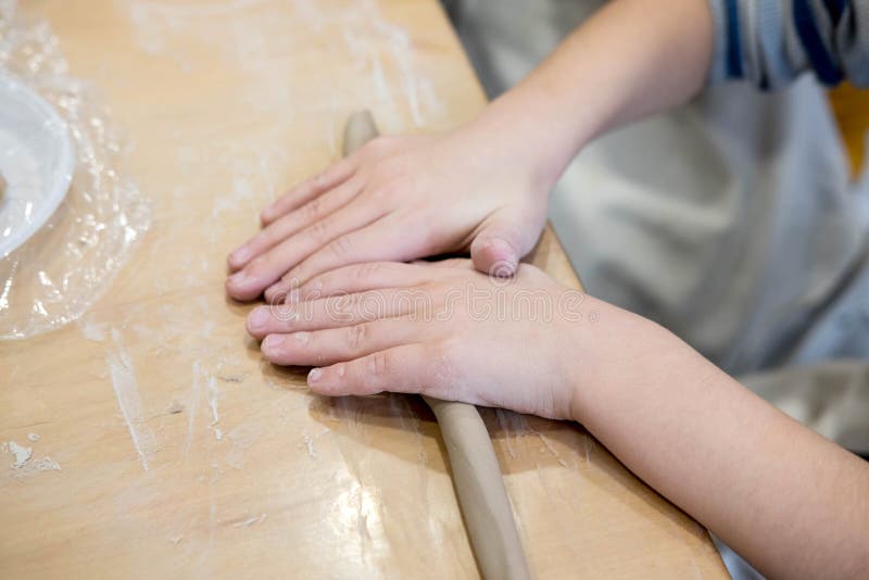 Children Hands that Mold from Clay. Children Creativity. Crafts from ...