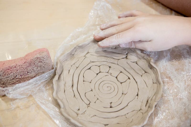 Children Hands that Mold from Clay. Children Creativity. Crafts from ...