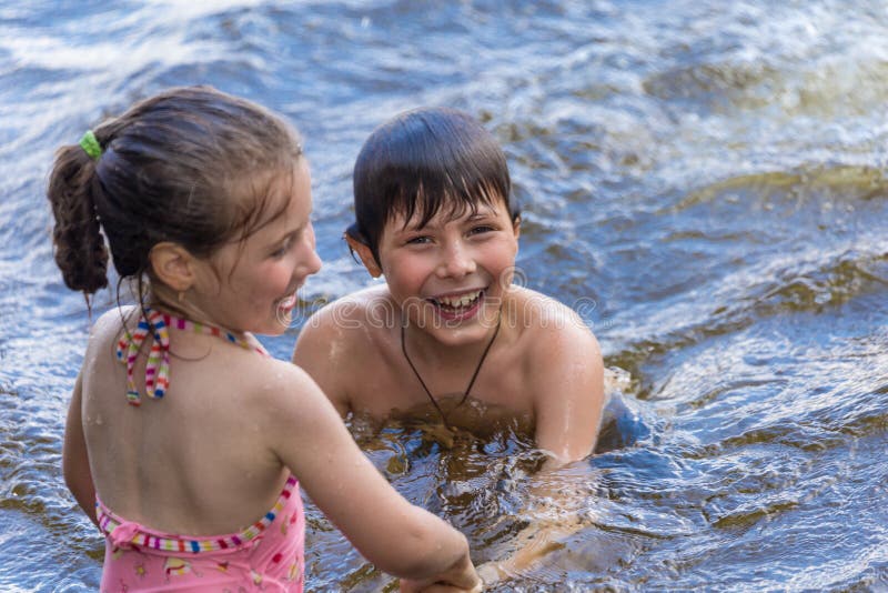 Children Have Fun in a Lake Stock Photo - Image of enjoyment, laughing ...