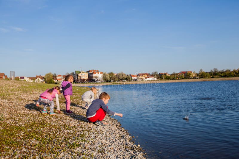 Children have fun outdoor stock photo. Image of play - 92459818