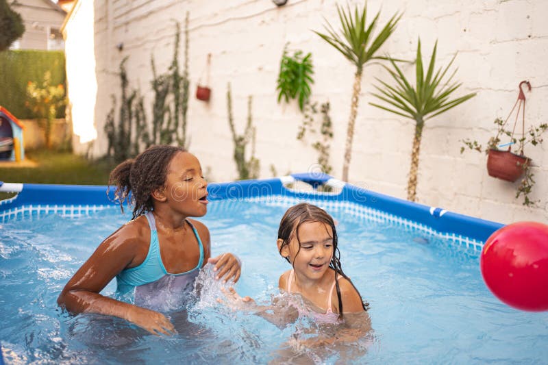 Children Have Fun Playing in a Colorful Inflatable Pool Outside Stock ...
