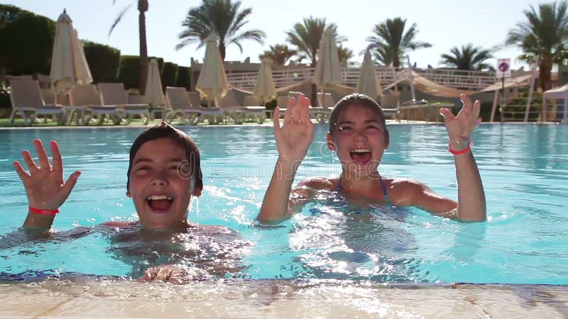 Children Have Fun in a Swimming Pool Stock Video - Video of outdoors, sunlight: 42090771
